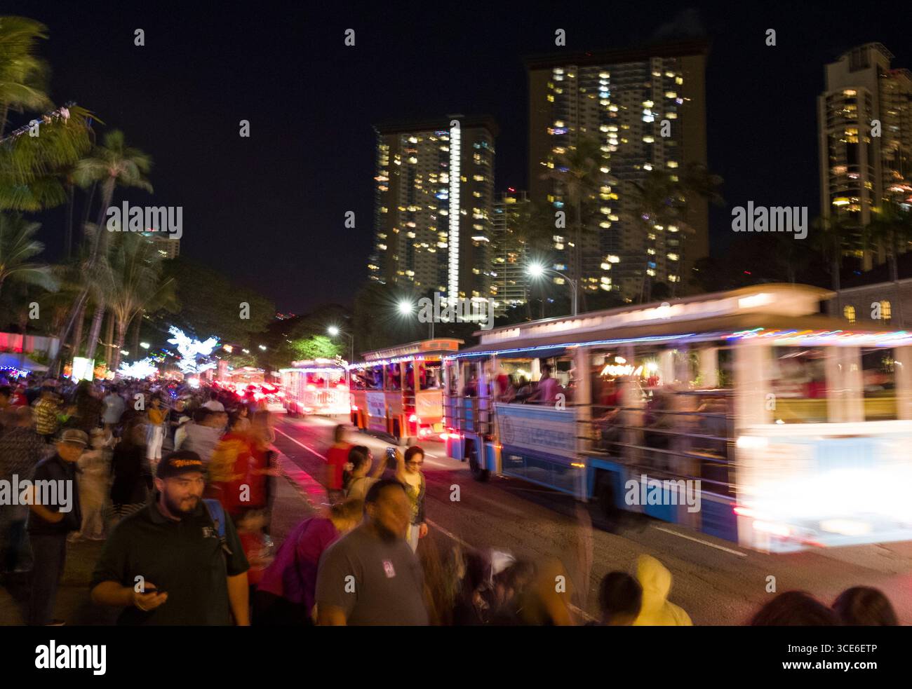Motorized trolleys filled with people sightseeing the Honolulu City ...