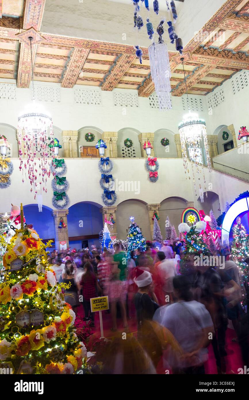 Christmas trees in various styles on display inside the Honolulu Hale ...