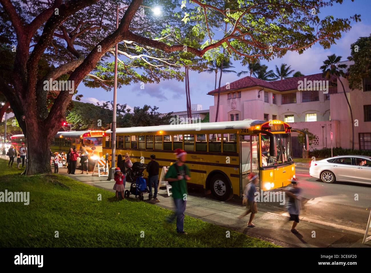 People unloading from chartered school buses parked on roadside to see ...