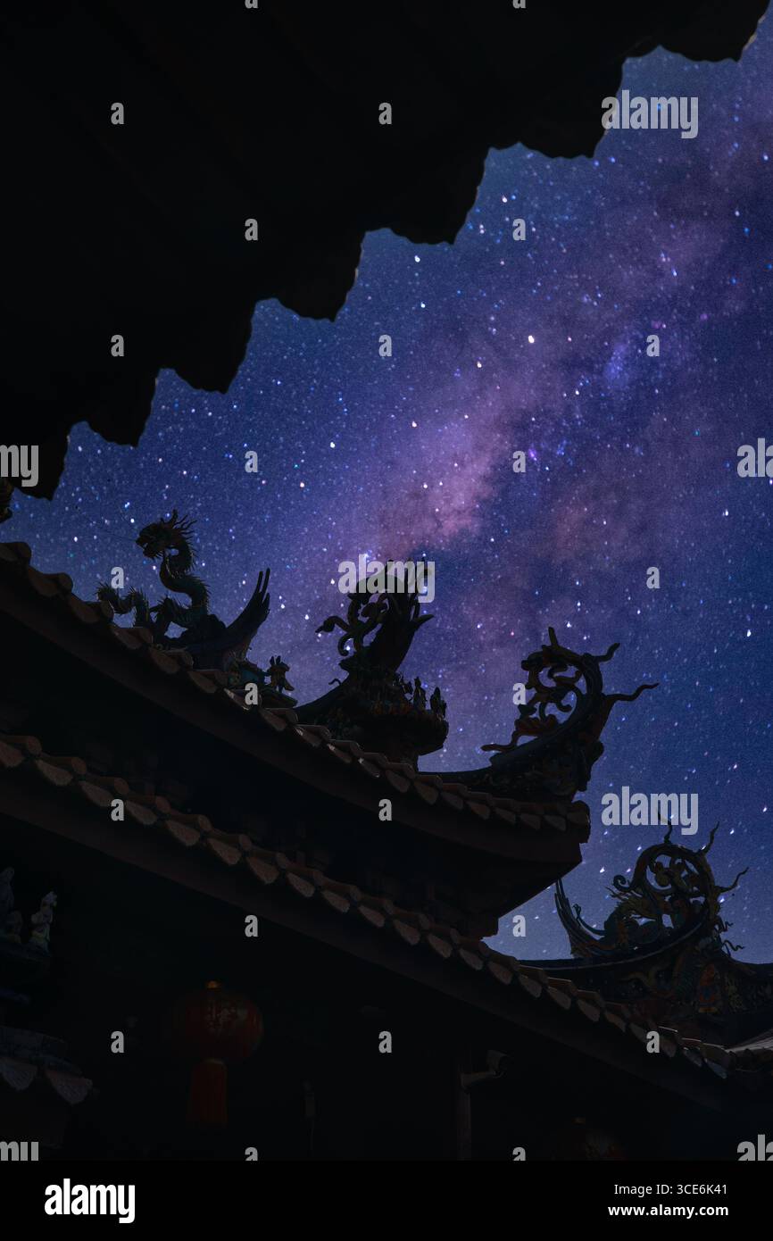 Traditional Chinese temple architecture under a starry night sky Stock ...