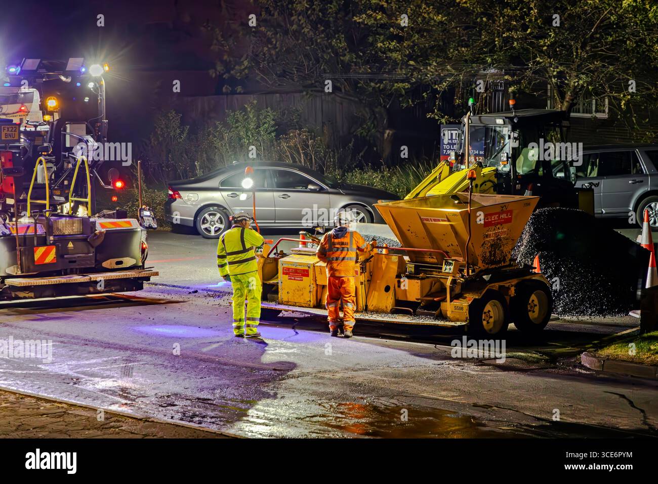 Road construction workers, machinery and equipment, resurfacing ...