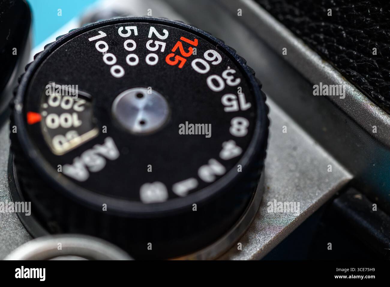 Close-up of a vintage camera shutter speed dial with numbers and ASA ...