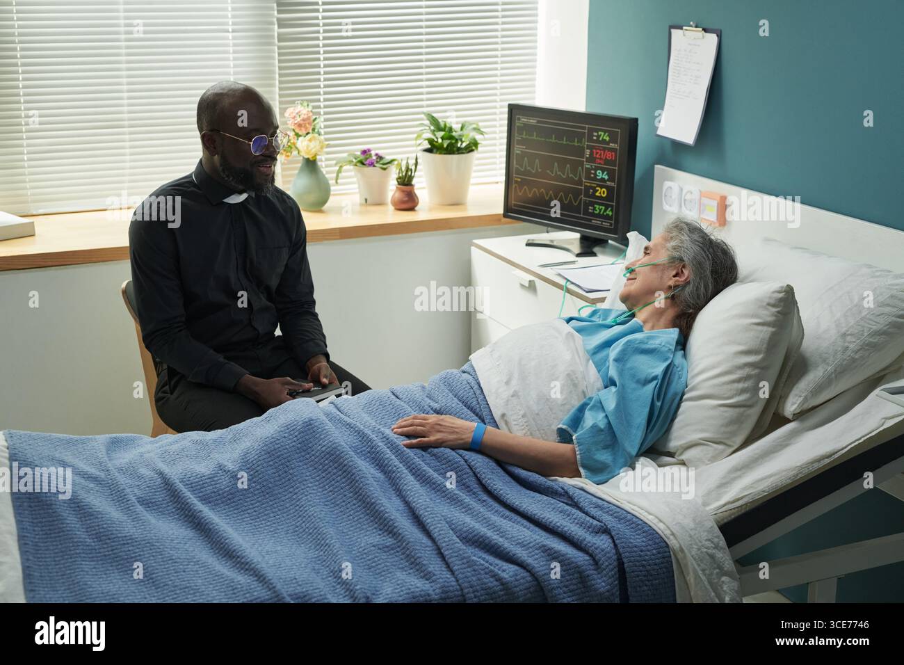 Middle Aged Black Male Priest Comforting Senior Caucasian Woman in ...