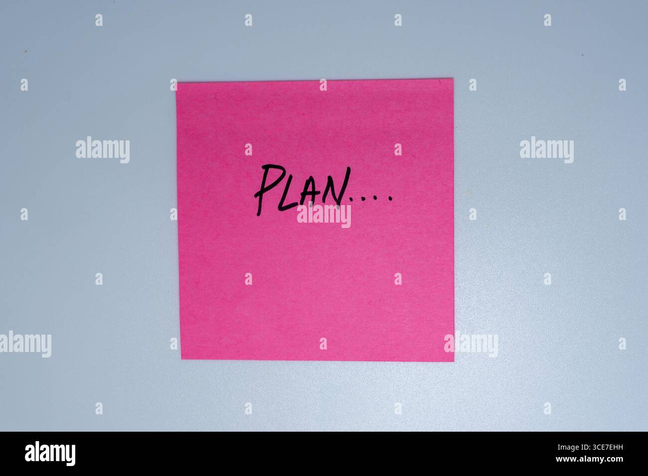 Pink Sticky Note with Handwritten Word Plan on White Background Stock ...