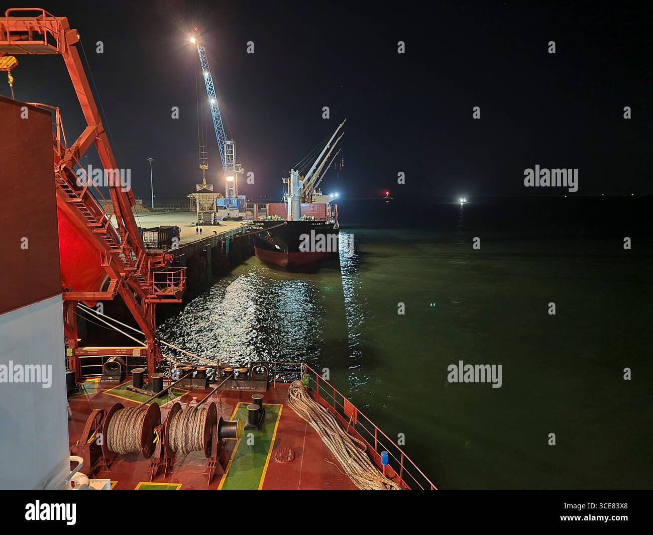 Cargo ship maneuvering night hi-res stock photography and images - Alamy