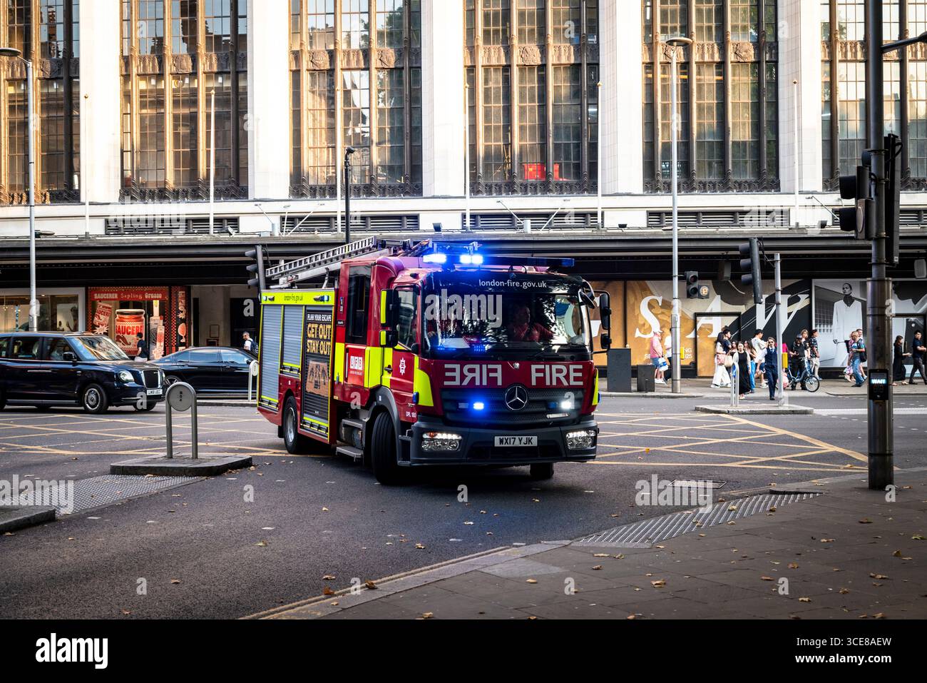 Fire brigade engine on call, Kensington High Street, W8, London ...