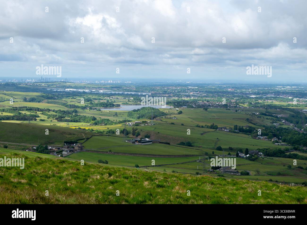 Rolling green hills of the Pennines and a distant view of the ...