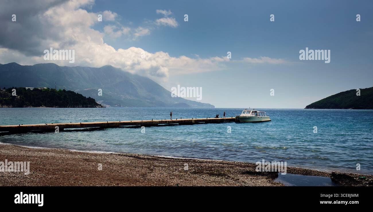 Floating dock with excursion boat, Budva bay, Montenegro showing ...