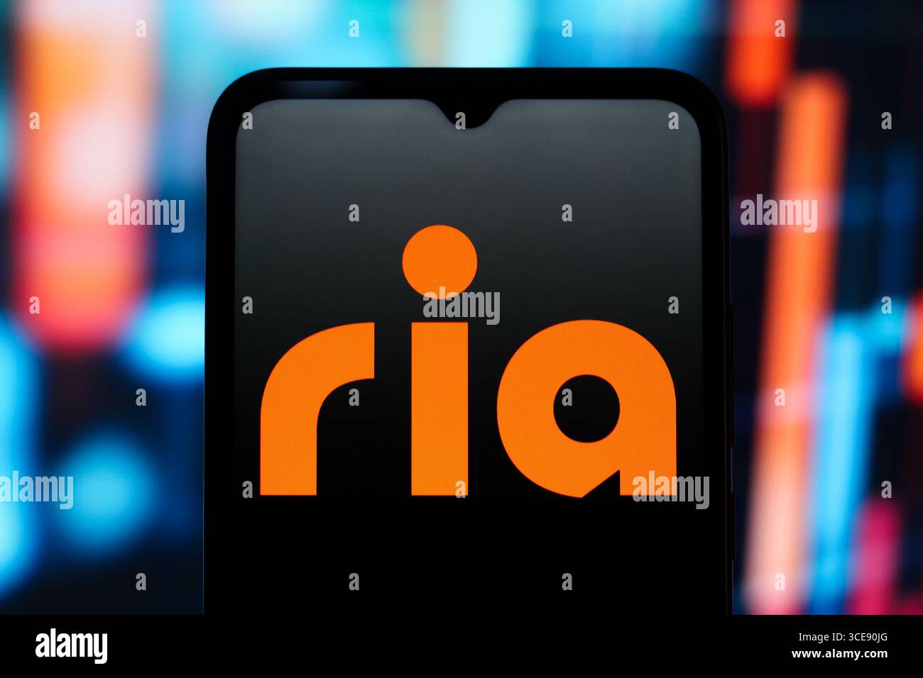 In this photo illustration, the Ria Money Transfer logo is seen ...