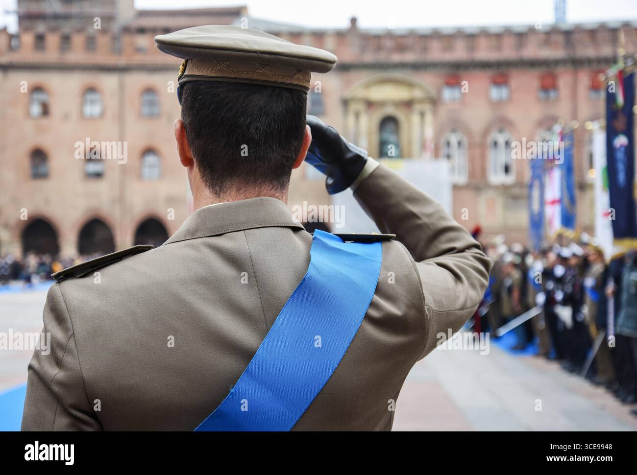 Soldier saluting during a public military ceremony in a historic city ...