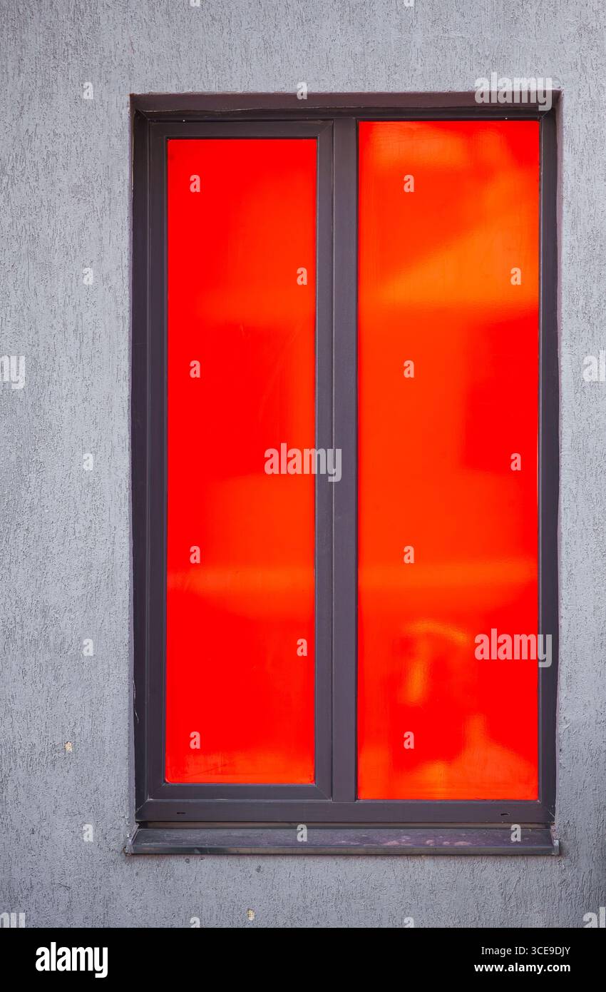 Red closed window on a gray wall Stock Photo - Alamy