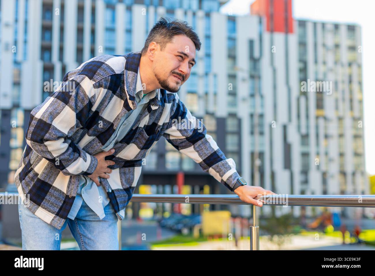 Caucasian mature man traveler feeling sudden strong abdominal stomach ...
