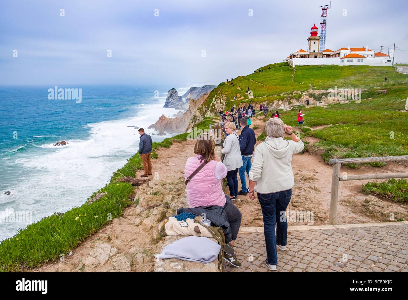 People exploring costal paths at Cabo da Roca Lighthouse, Sintra ...