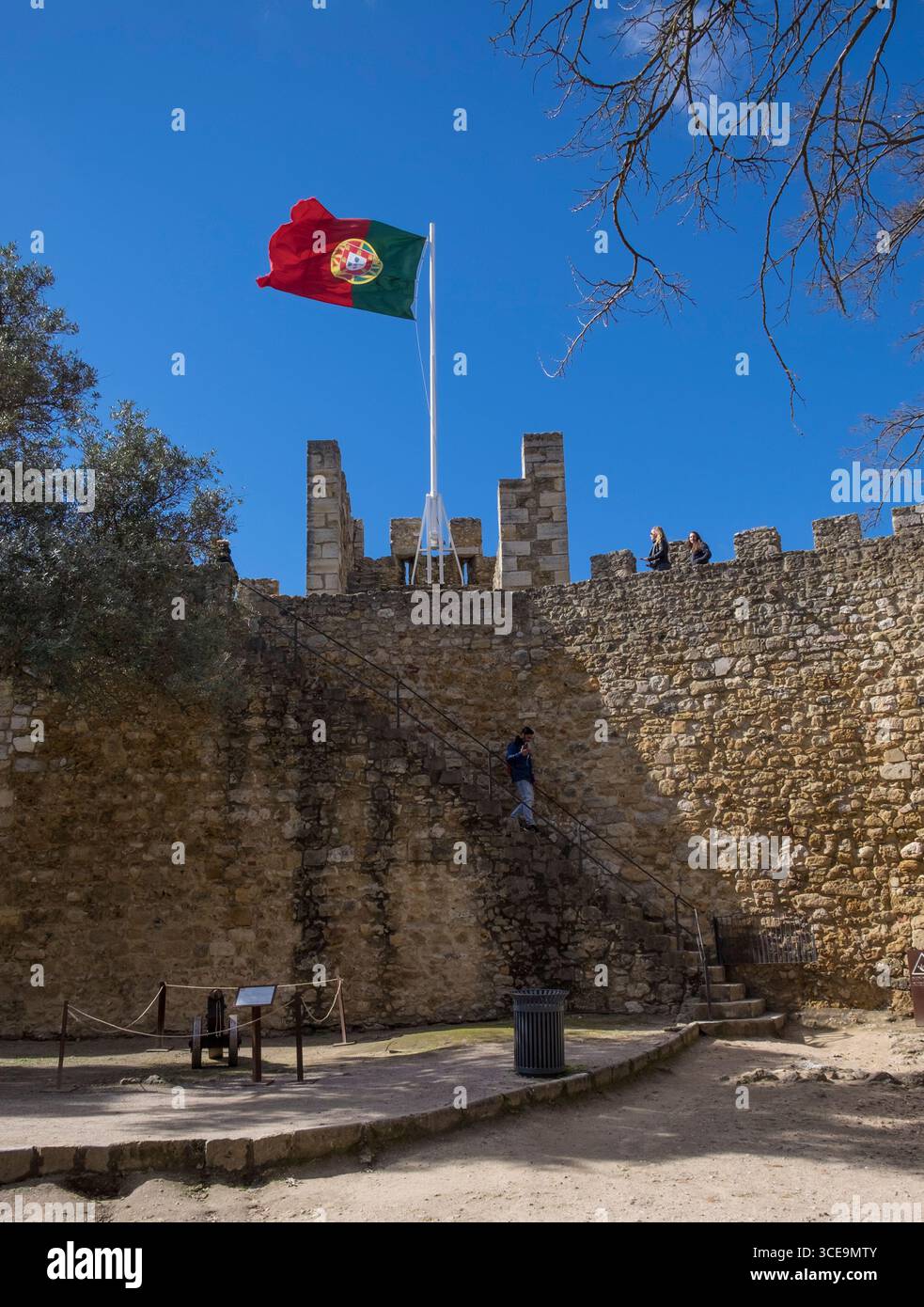 Portuguese flag flying above the hilltop Moorish castle Castelo de S ...