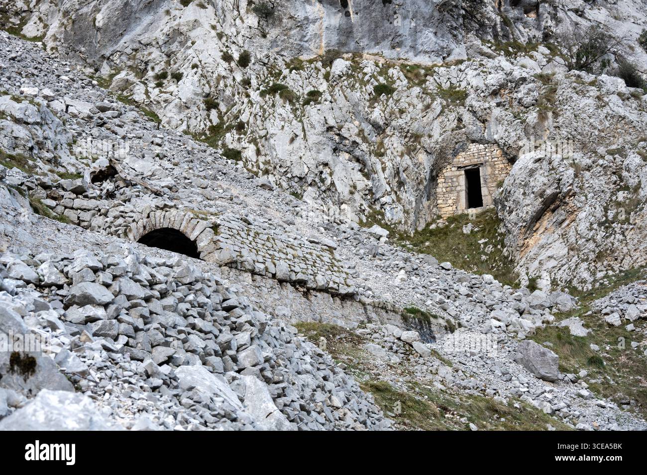 Ancient stone structures built into a rocky mountainside in Picos de ...