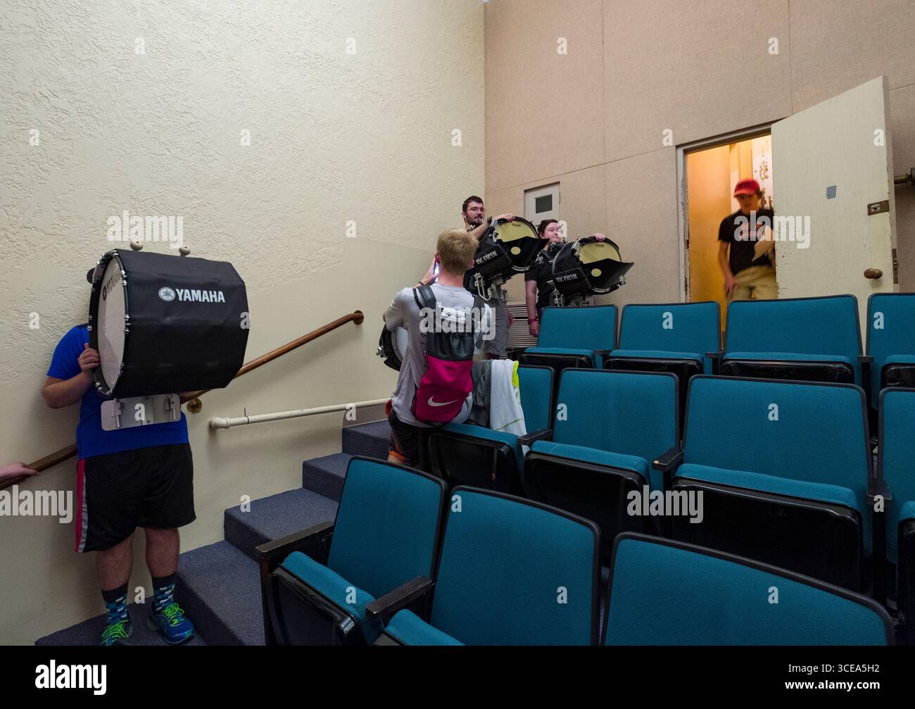 Members of the WPI Pep Band waiting to put their musical instruments ...