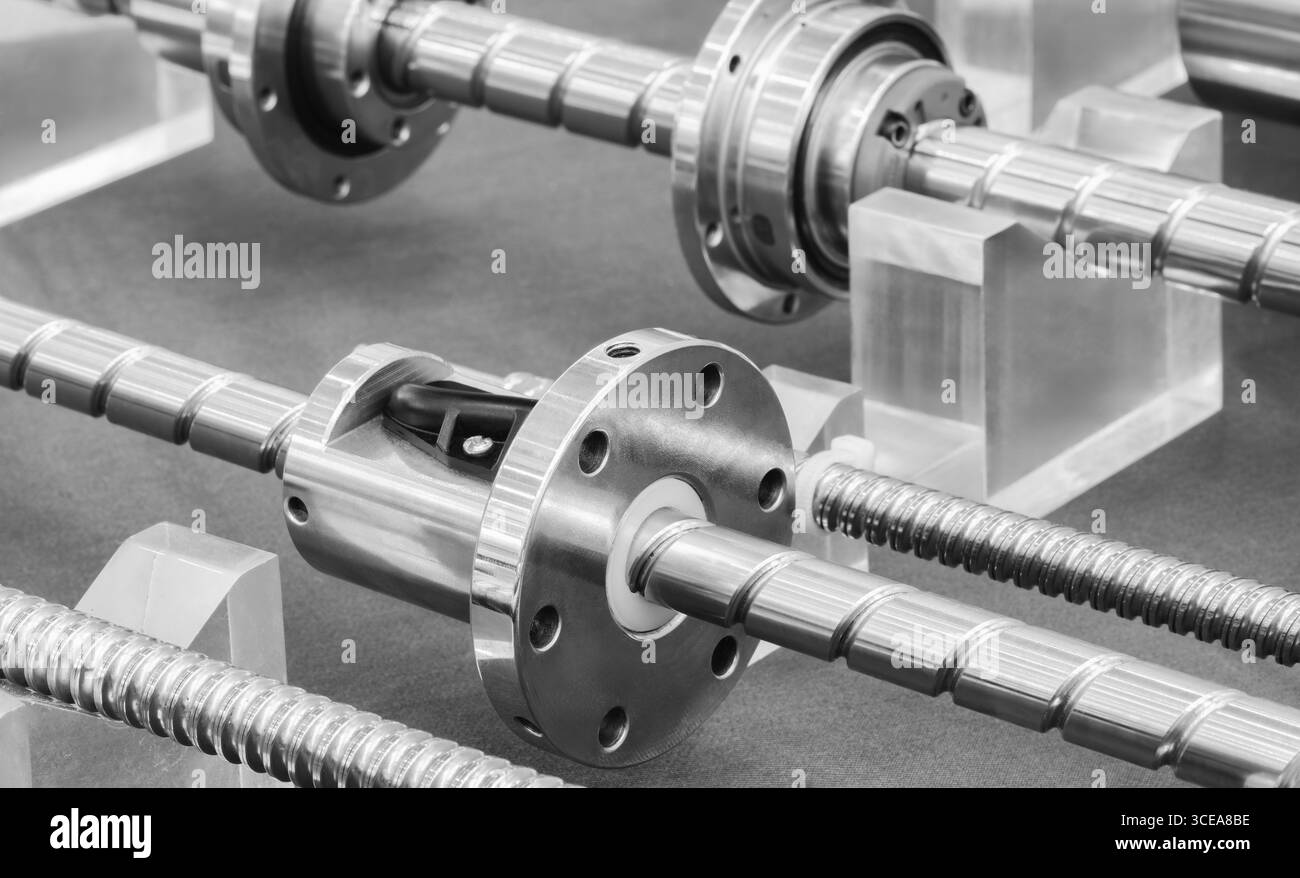 Close up of industrial metal screw shaft as part of screw transmission ...