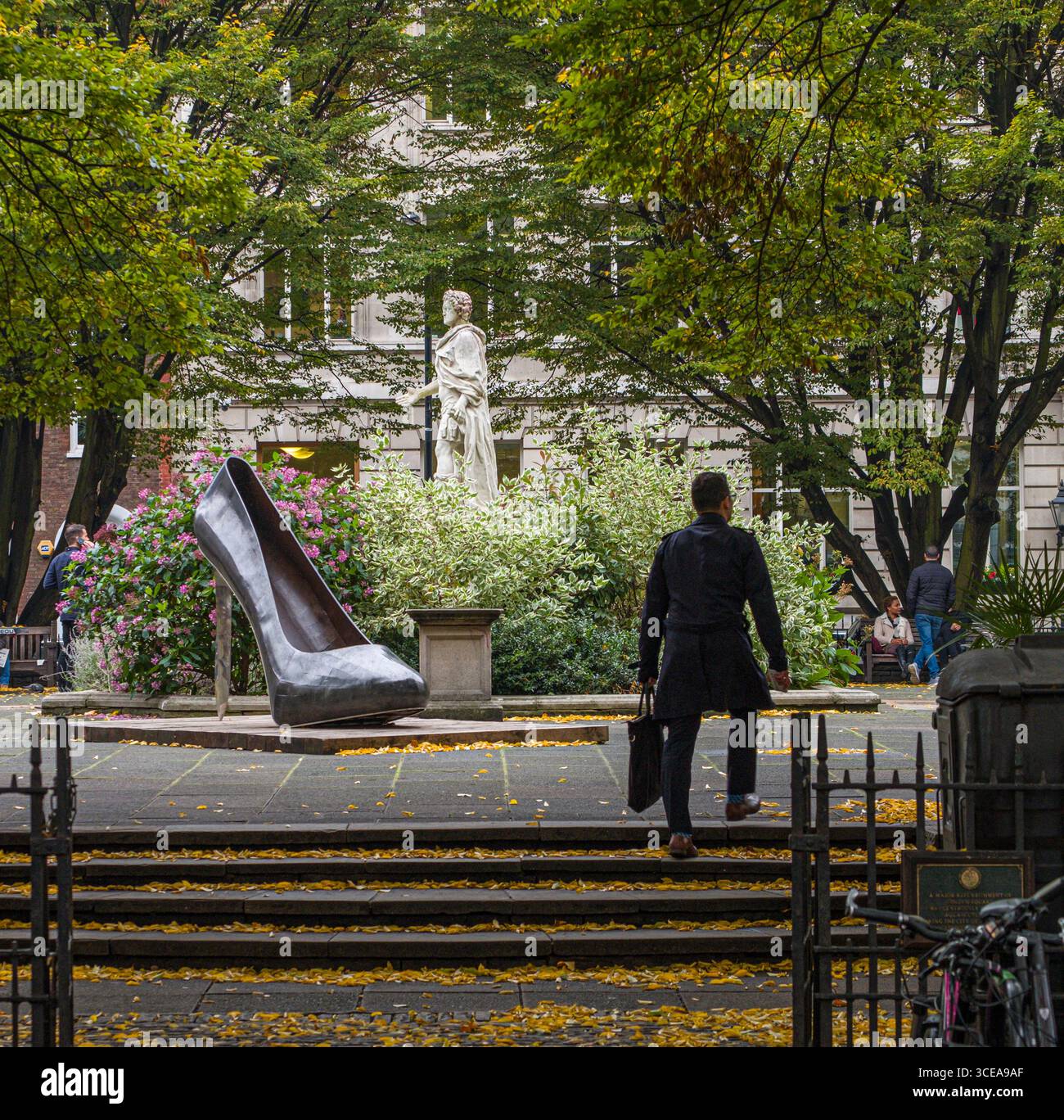 Man walking upstairs past hi-res stock photography and images - Alamy