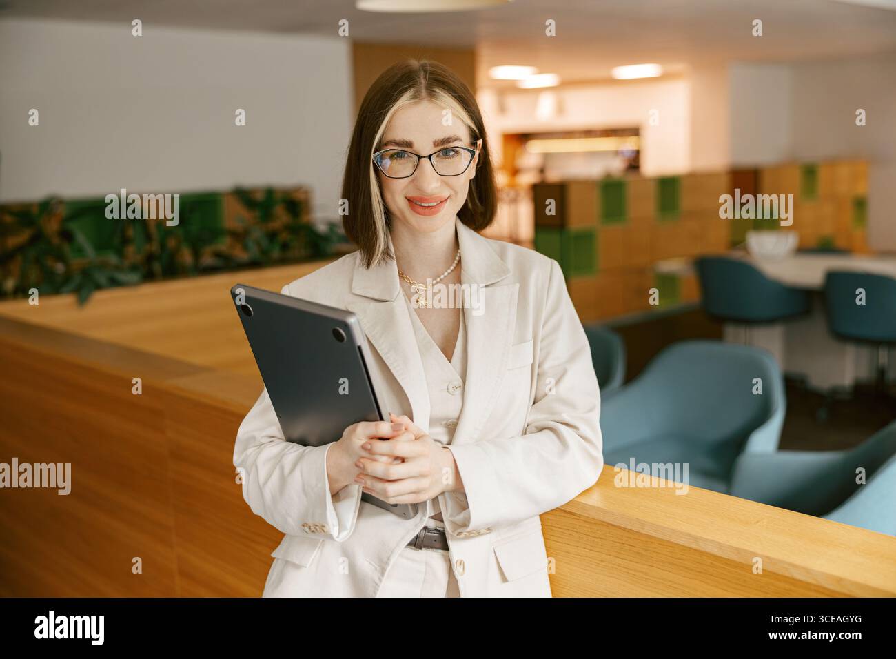 A professional businesswoman confidently working in a modern office ...