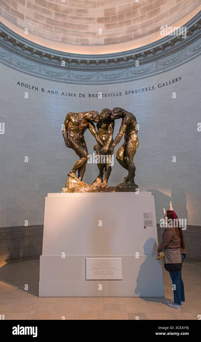 Woman reading placard on Auguste Rodin sculpture inside Legion of Honor ...