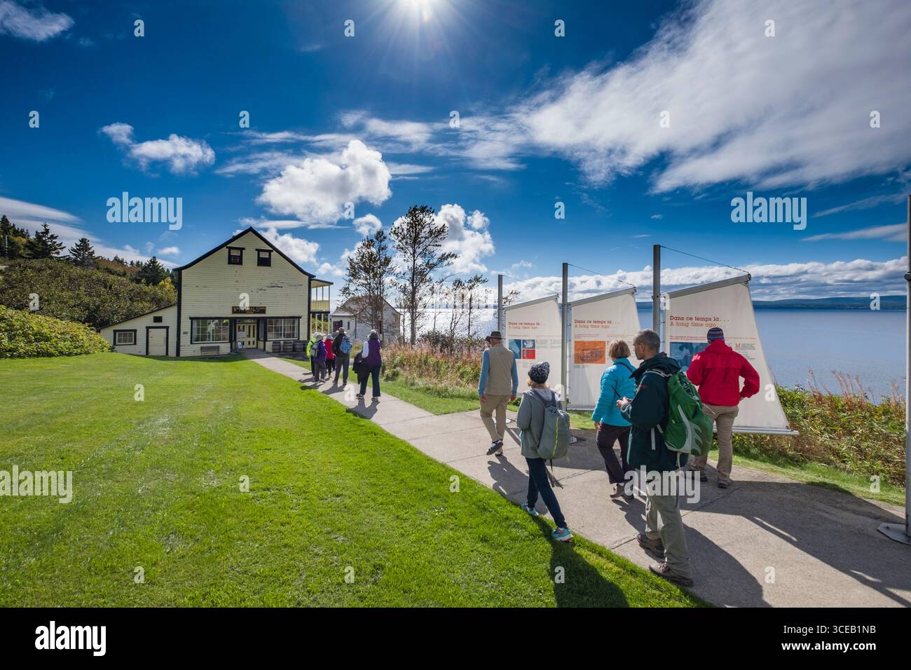 People walking towards Hyman & Son General Store, Forillon National ...