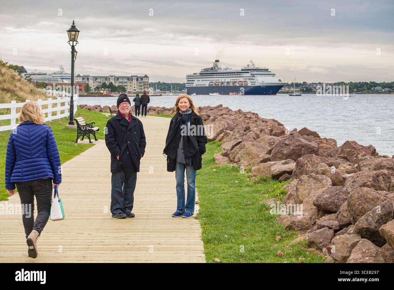 People walking on Victoria Park Boardwalk with the Holland America Line ...