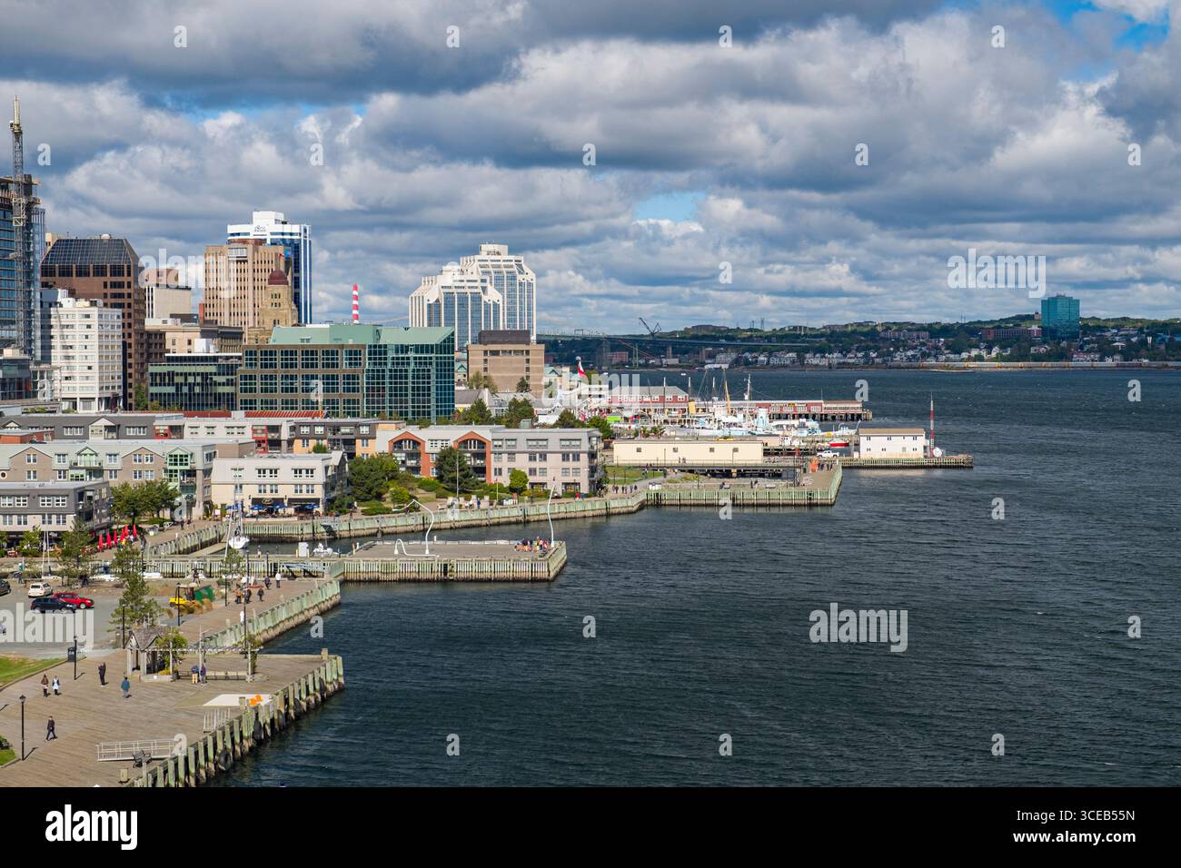 People walking on the Halifax Waterfront Boardwalk, Halifax Harbour ...