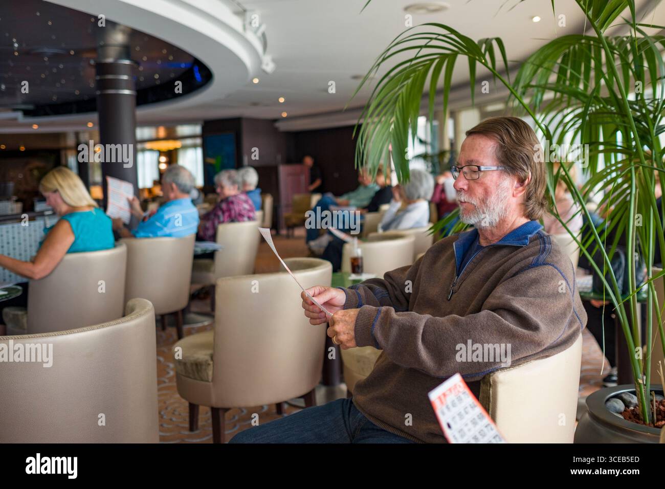 People playing BINGO aboard the Regent Seven Seas Mariner cruise ship ...