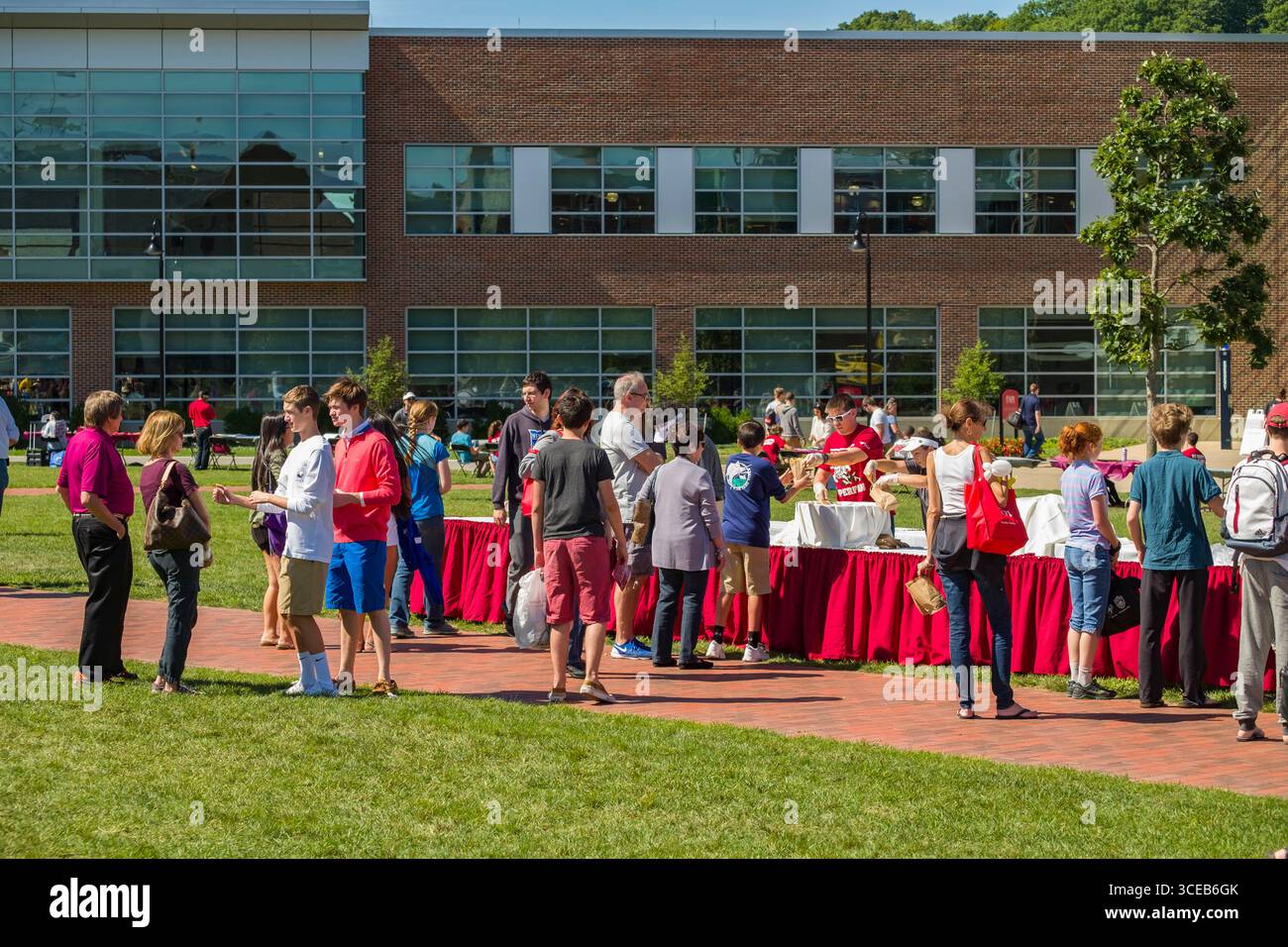 Parents and students standing in line for samples Gompei goat cheese ...