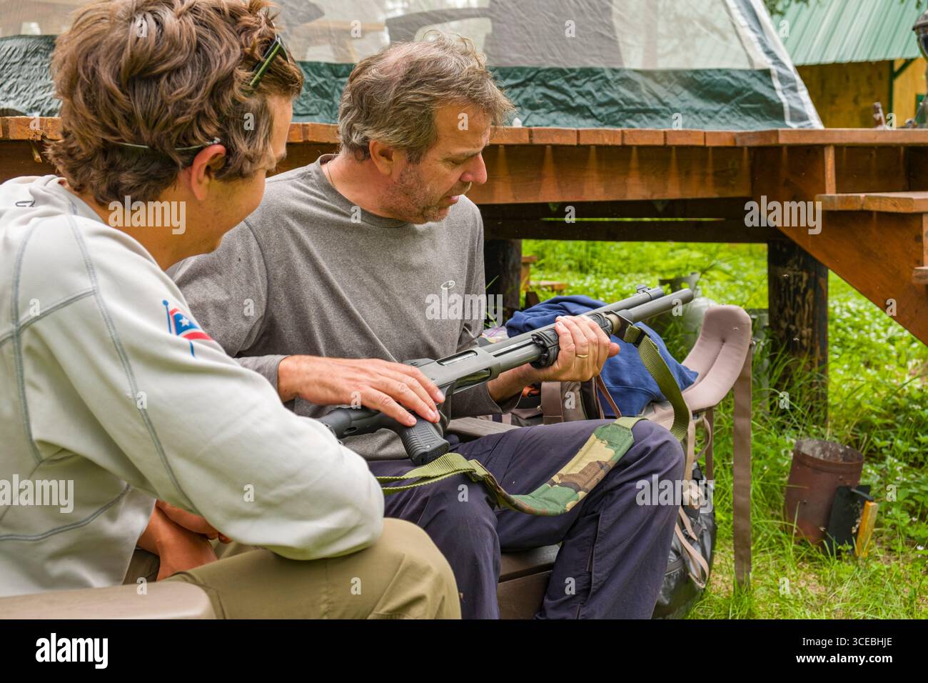 Father showing son proper hi-res stock photography and images - Alamy