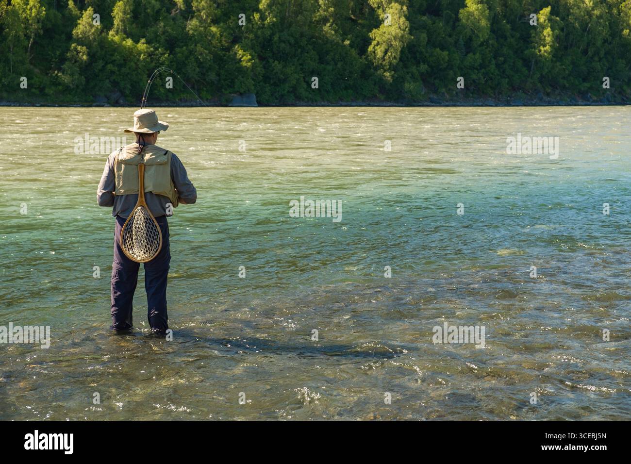 Man fly fishing the confluence of the Indian and Susitna rivers where ...