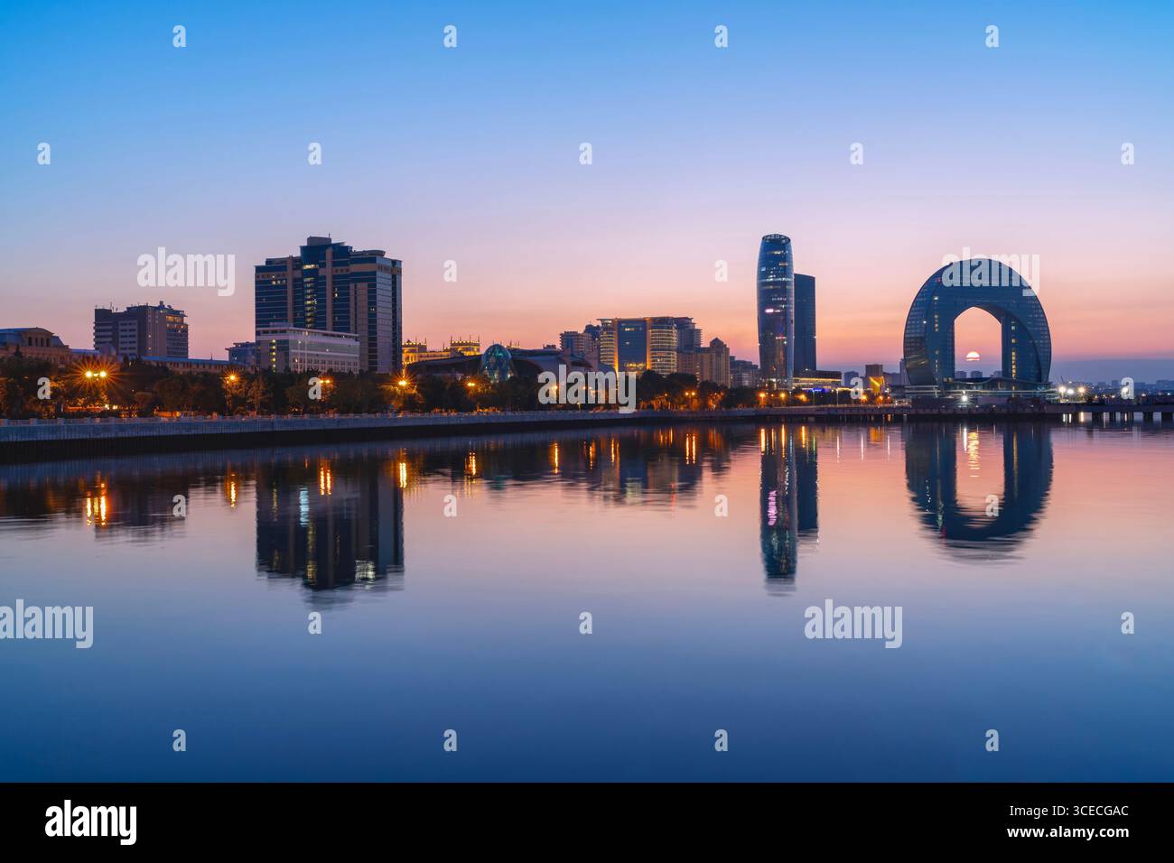 Skyline of Baku at the sunrise with reflections in Caspian Sea, Baku ...