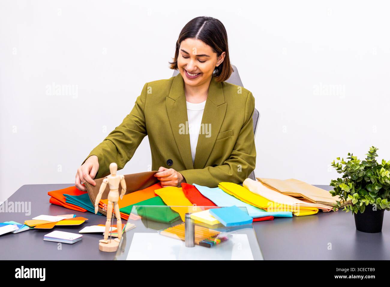 A professional image consultant at work, displaying vibrant fabric ...