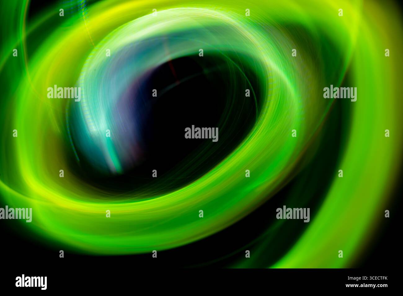 A dynamic swirl of vibrant green neon lights creating an abstract ...