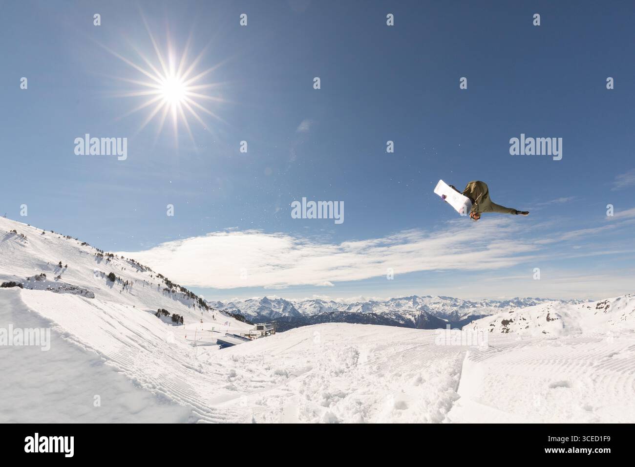 Snowboarder performing trick snow hi-res stock photography and images ...