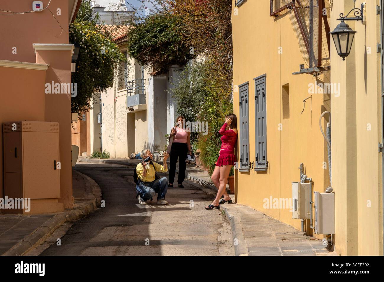 Behind-the-scenes of a photographer and model in discussion, Athens ...