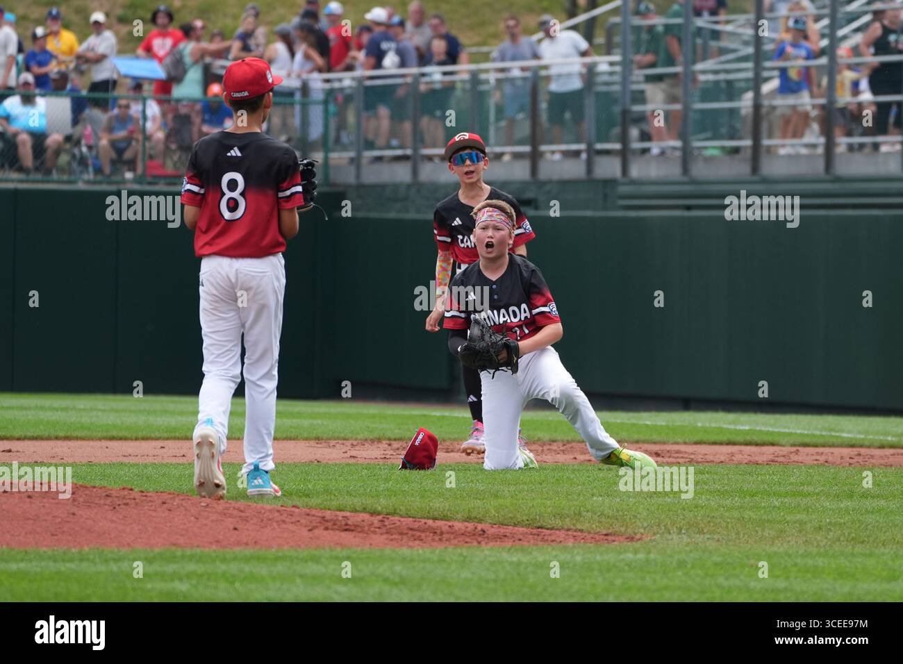 Canada's Misha Lee celebrates after making a diving catch during the ...