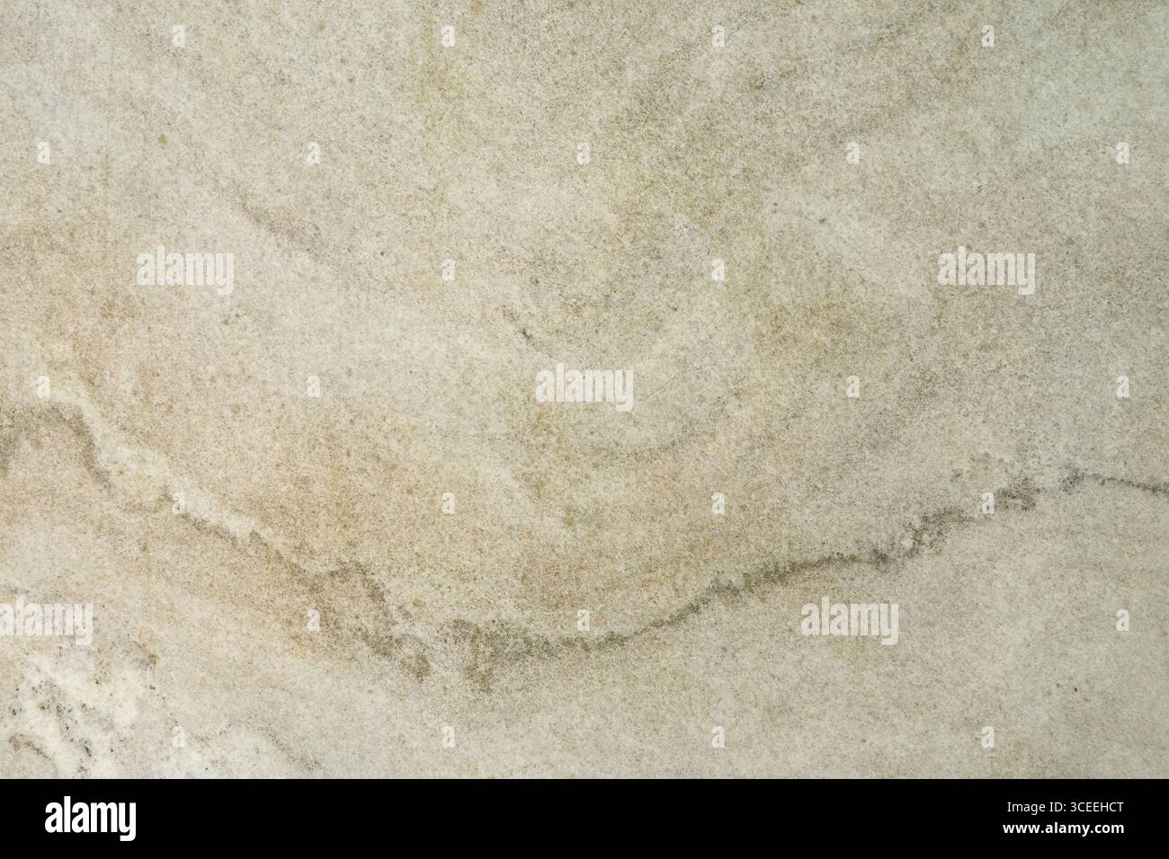 Unfinished light grey marble with beige undertones. Surface shows ...
