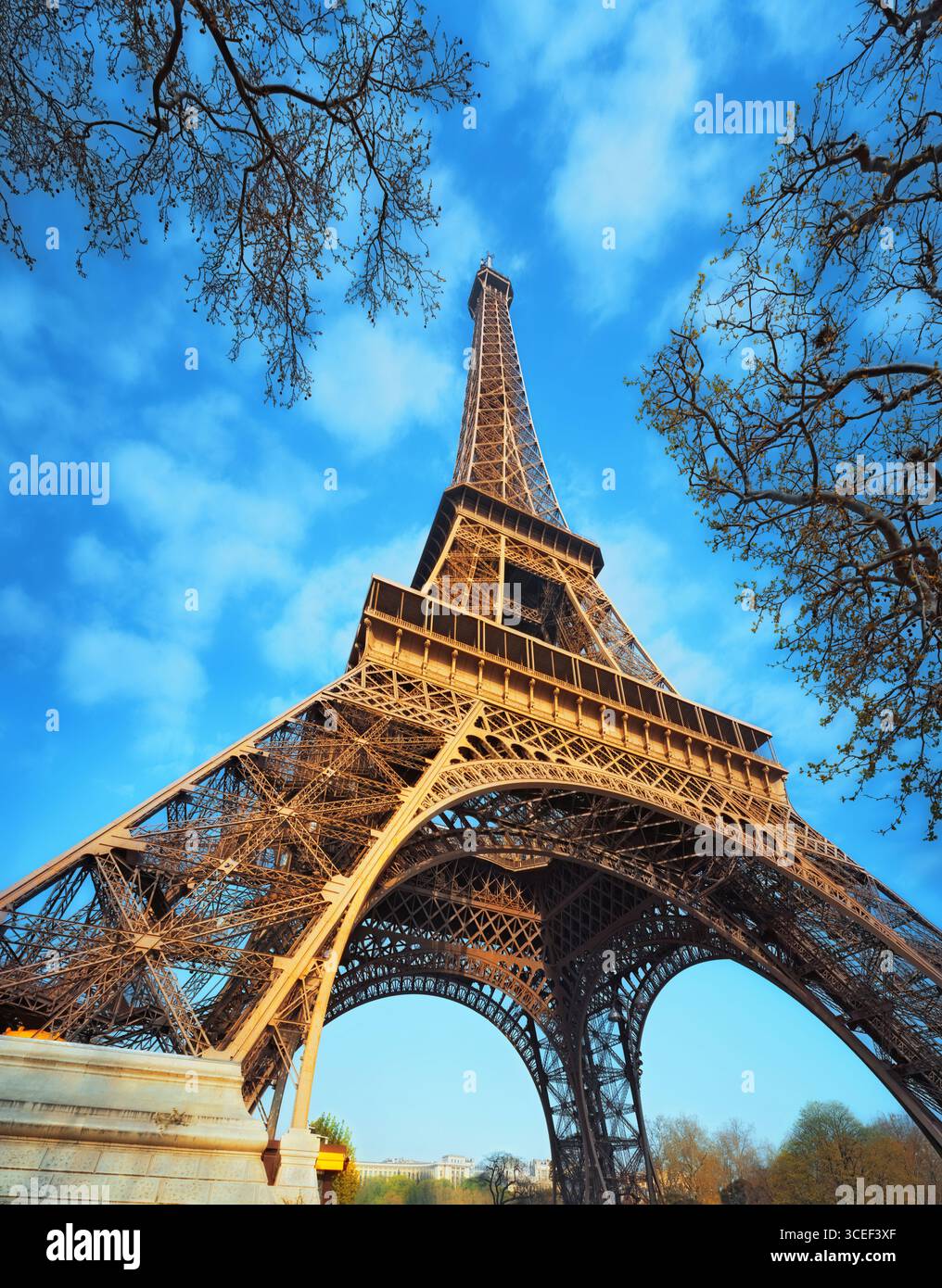 The Eiffel Tower, as seen from ground level in Paris, France, creating ...