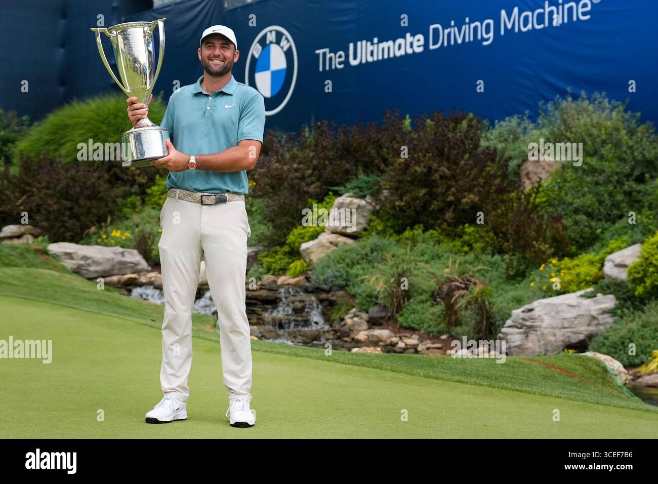 Scottie Scheffler holds the trophy after winning the BMW Championship ...