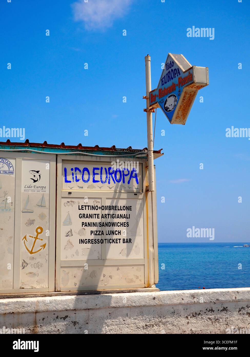 beach restaurant sign with blue sea and clear sky in Taormina Sicily ...
