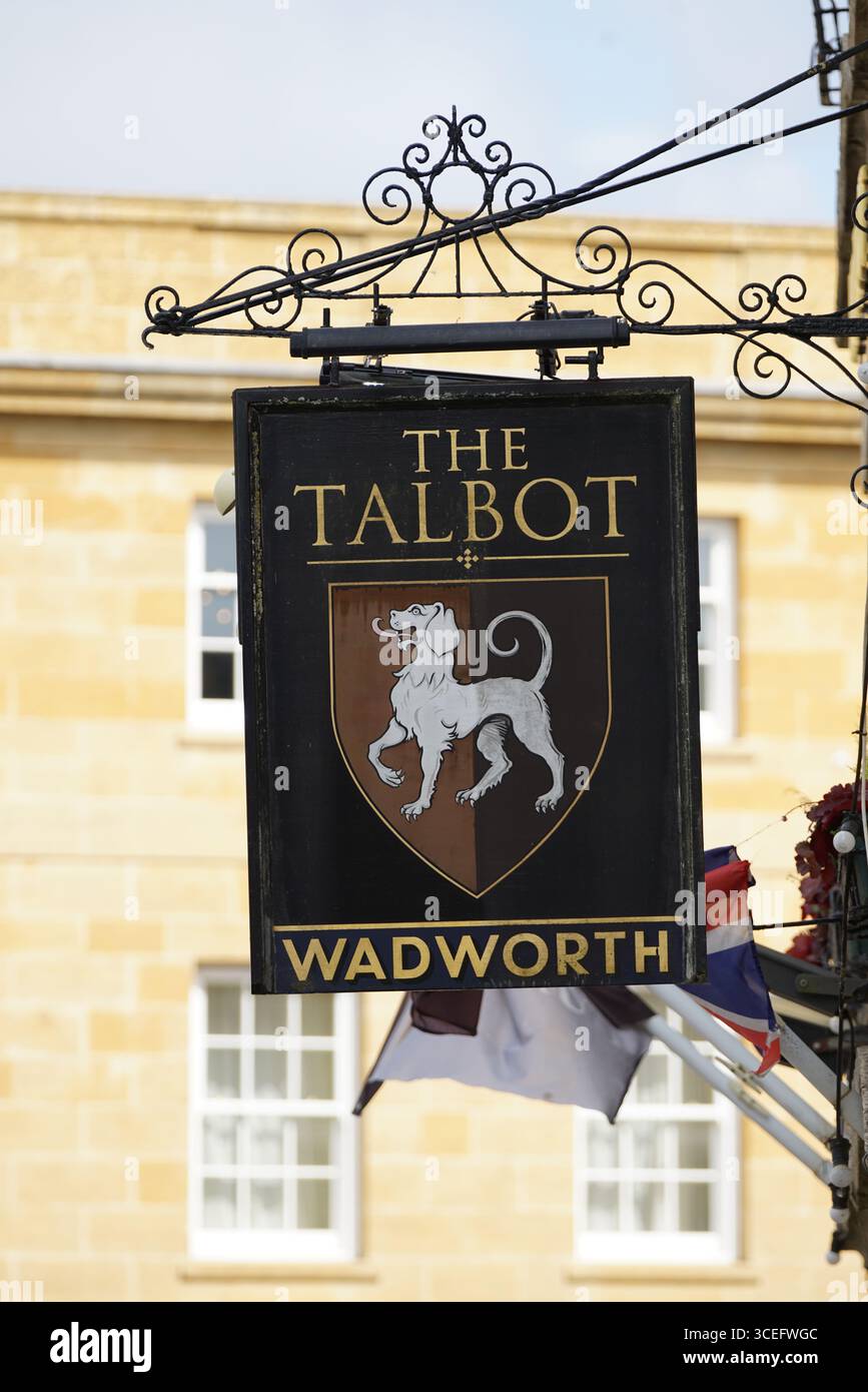 Vintage Pub Signboard Featuring Heraldic Design and Ornate Ironwork ...
