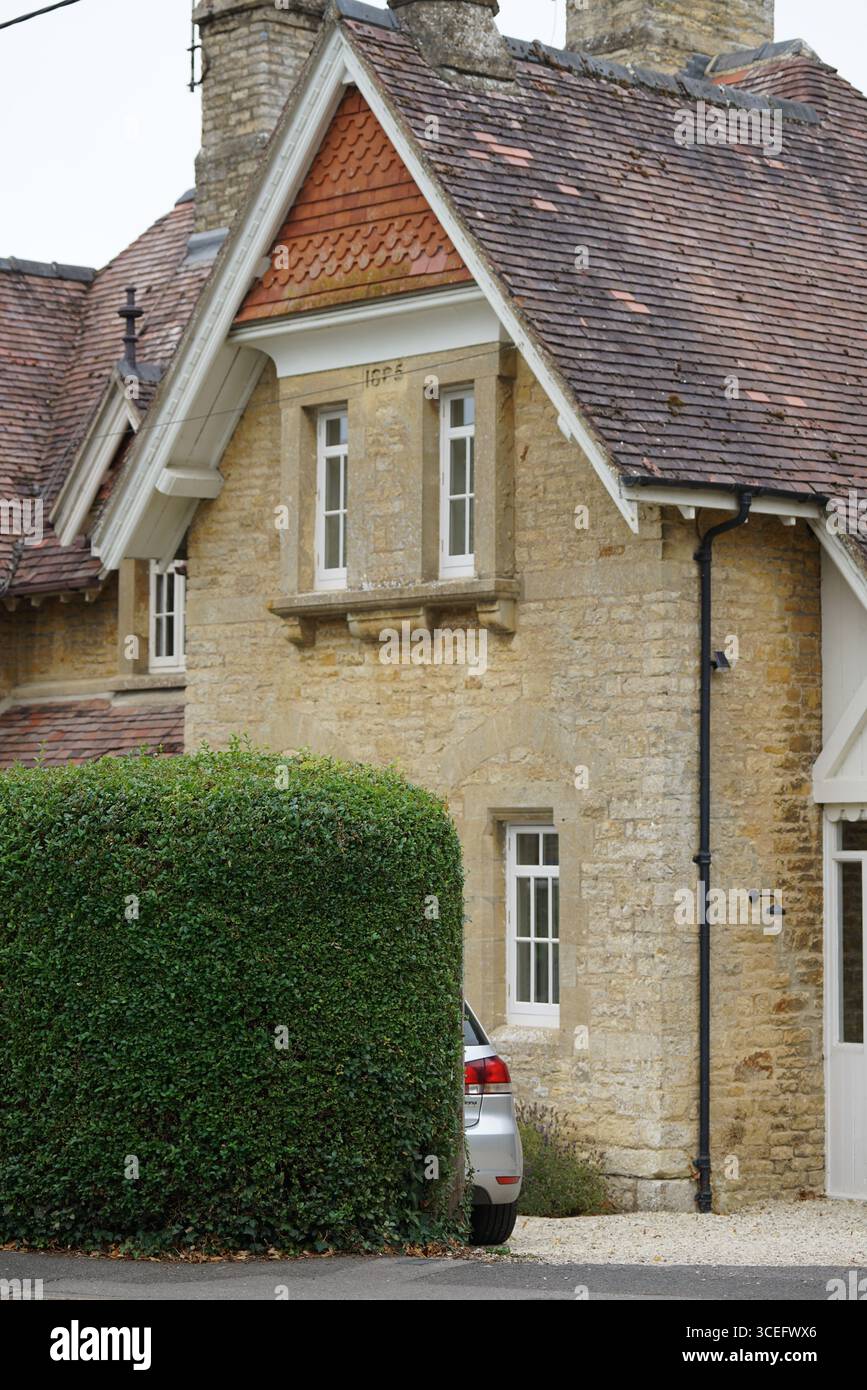 Traditional Stone Cottage with Tiled Roof and Trimmed Hedge. Churchill ...