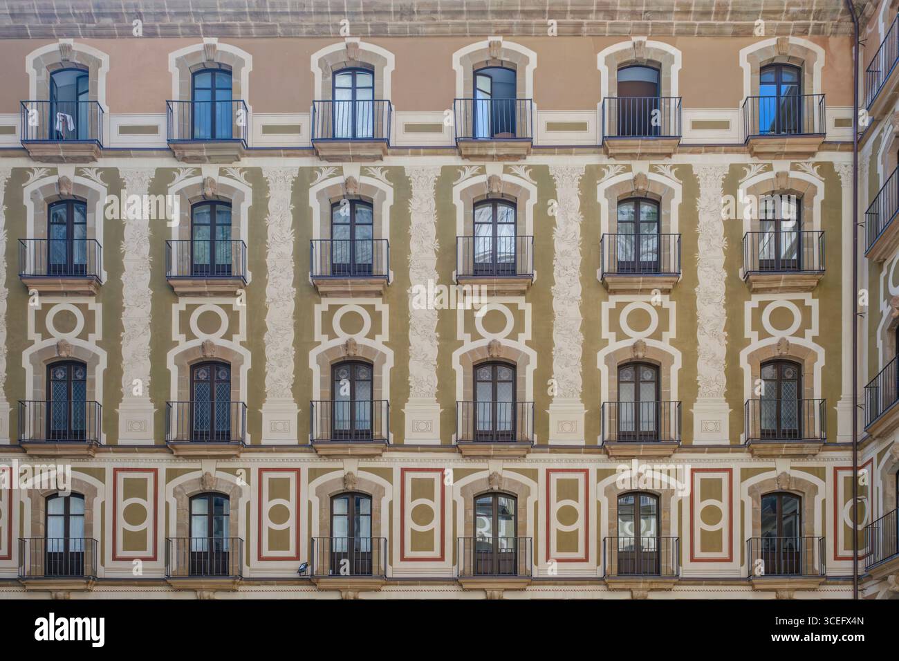 Ornate Baroque Facade With Symmetrical Windows And Iron Balconies At ...