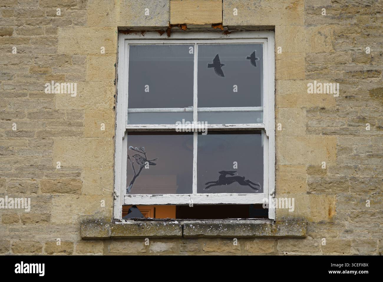 Old Rustic Window With Animal Silhouettes and Brick Wall Surroundings ...