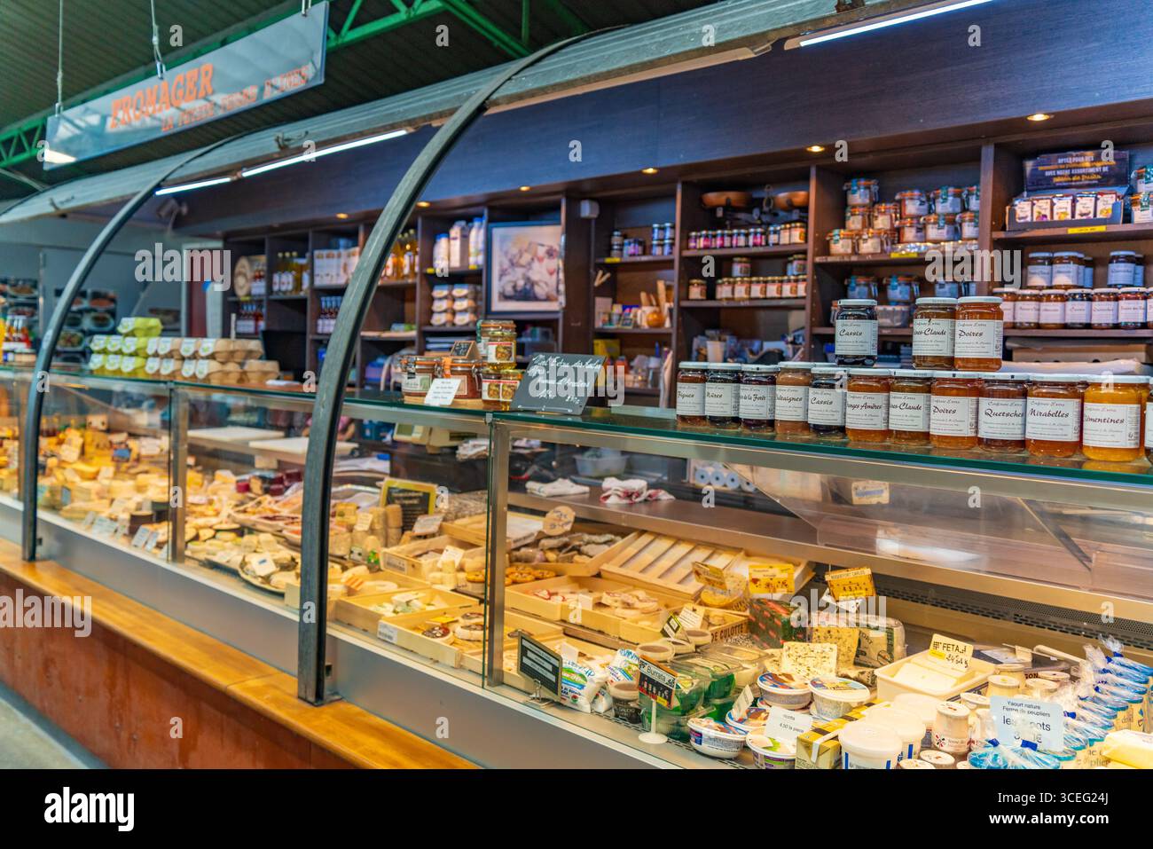 A cheese stall in Marche des Enfants Rouges, the oldest market in Paris ...