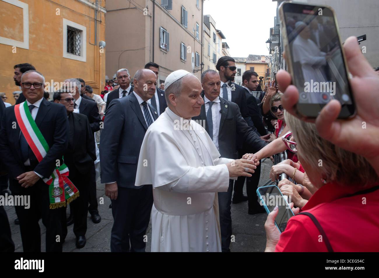 Pope Leo XIV greets the faithful upon his arrival to lead a Mass at the ...