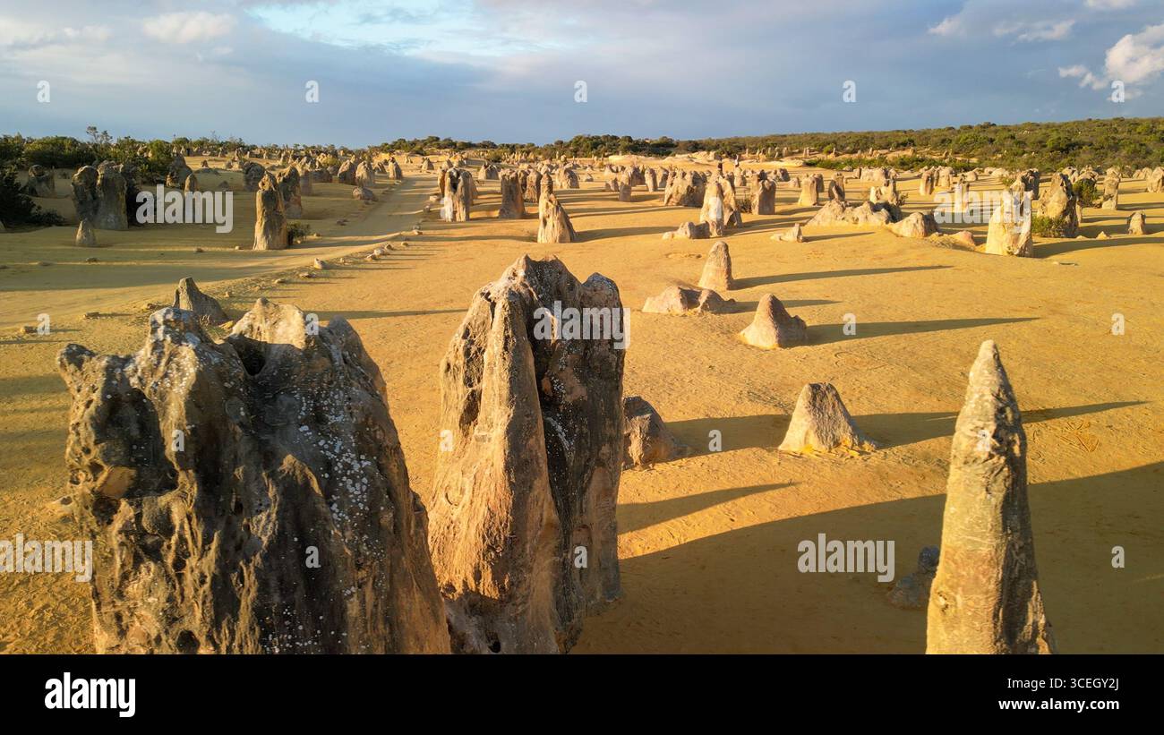 Stunning bird's-eye view of Pinnacles Desert under a vibrant sunset sky ...