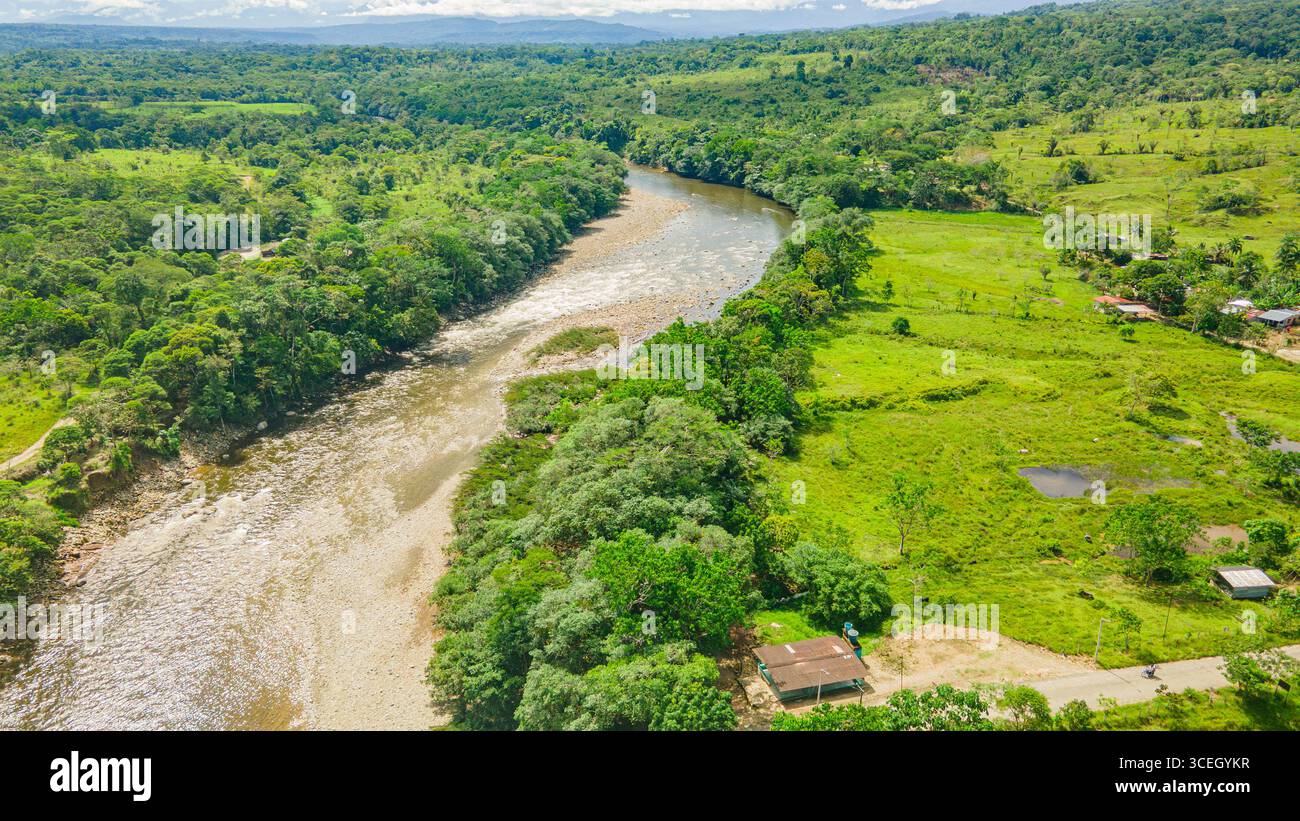 Stunning aerial view of the Putumayo River surrounded by lush greenery ...