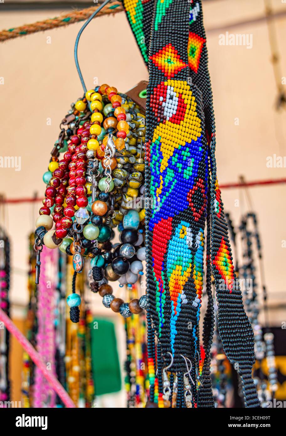 A vibrant collection of handcrafted beaded jewelry displayed in ...